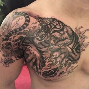 The Symbolism and Origins of Tiger Chest Tattoo: - TattooQuestions.com